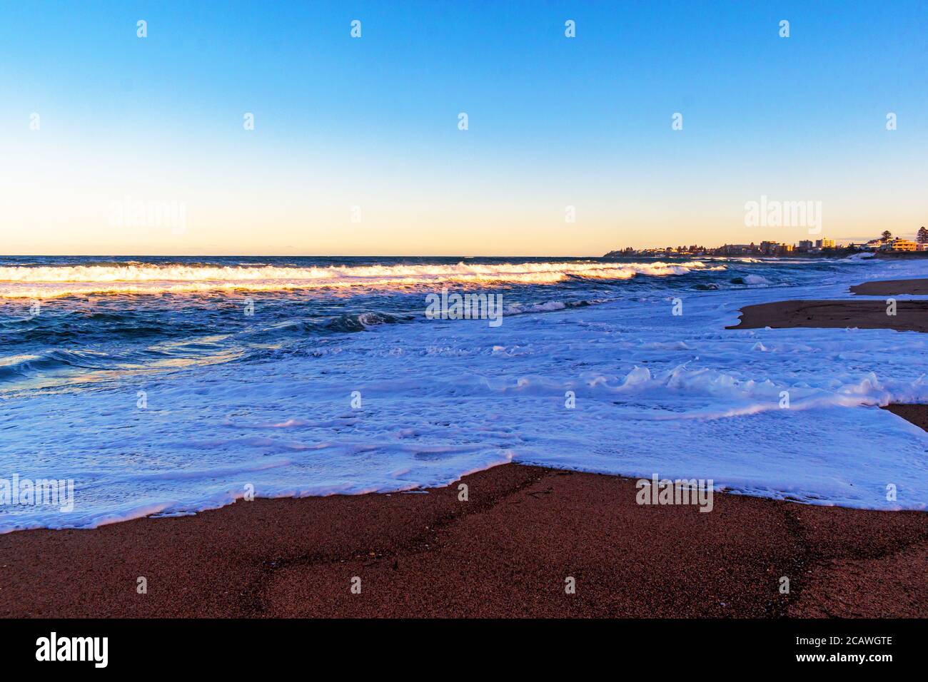 Beach surrounded by the sea during a beautiful sunrise - perfect for ...