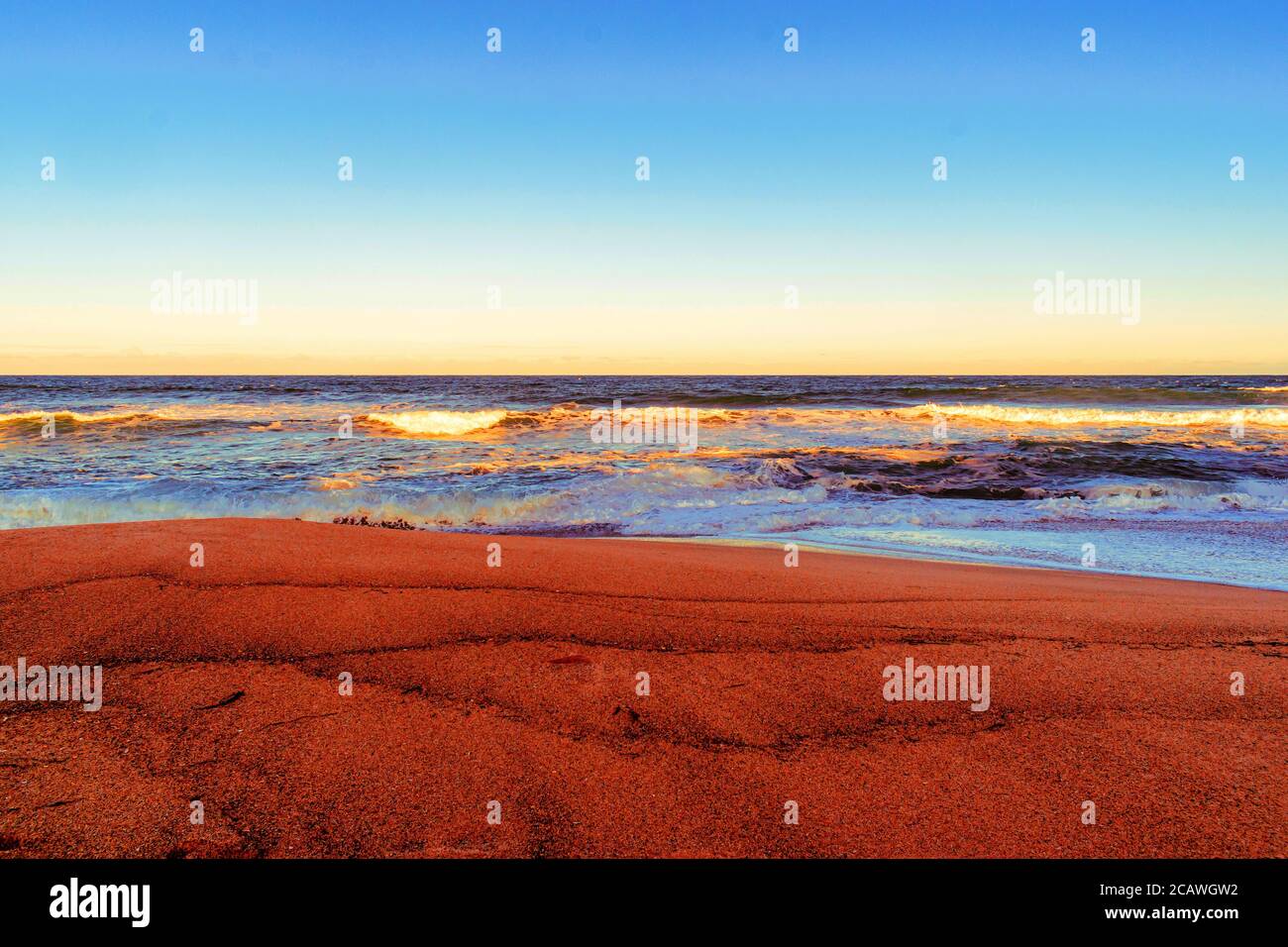 Beach surrounded by the sea during a beautiful sunrise - perfect for ...