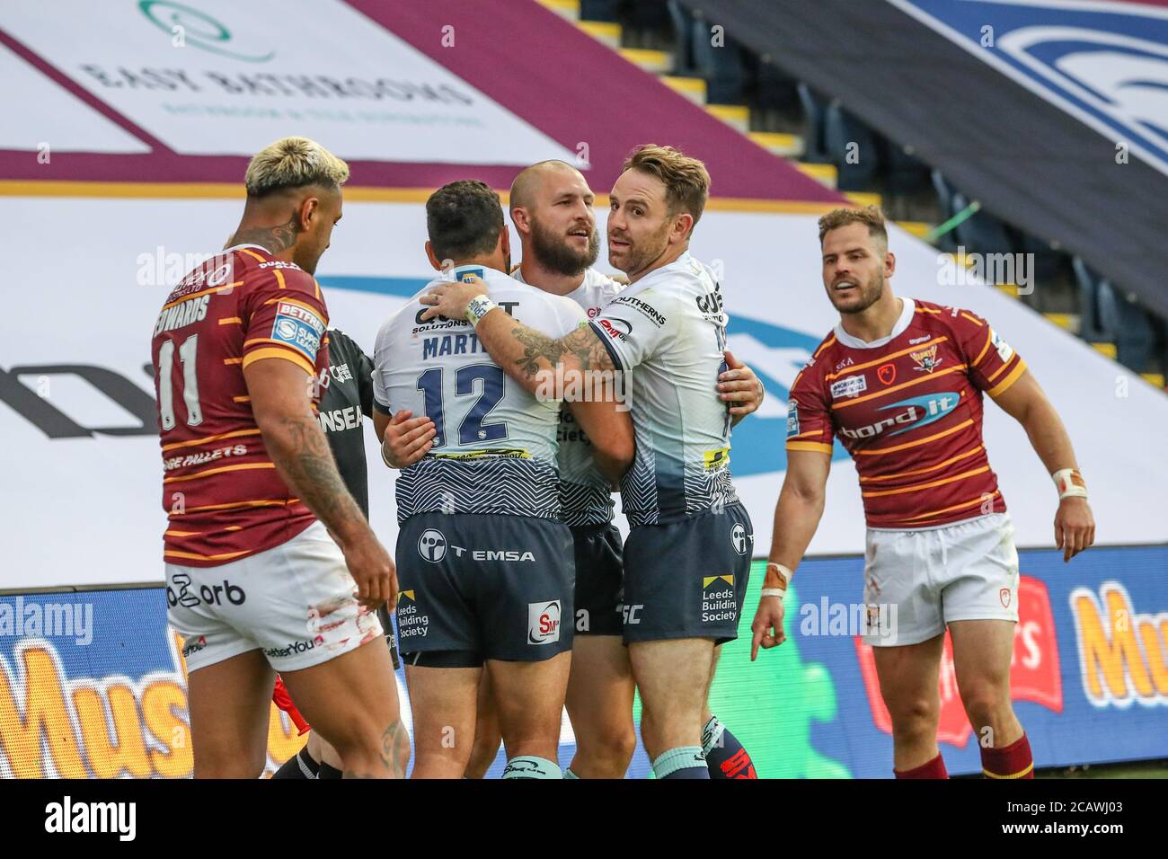 Luke Briscoe (24) of Leeds Rhinos celebrates his try with team mates ...