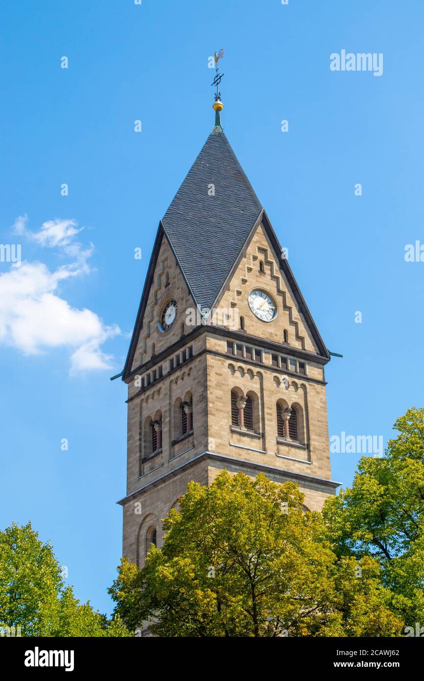 tower of Nikolaus church in Cologne, trees in foreground Stock Photo ...