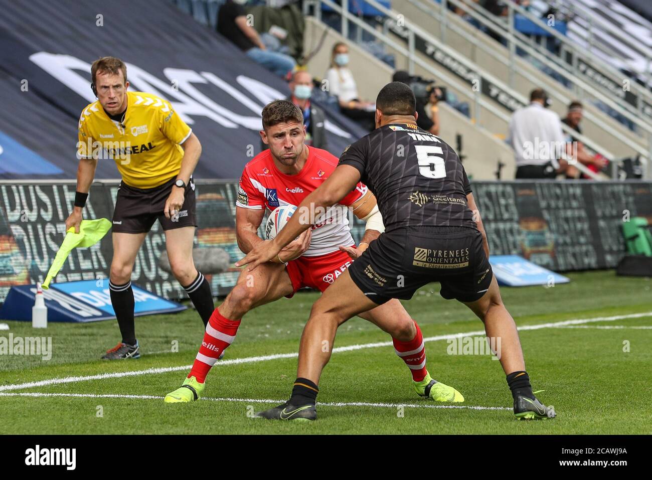 Tommy Makinson (2) of St Helens looks for a way past Fouad Yaha (5) of Catalans Dragons Stock ...