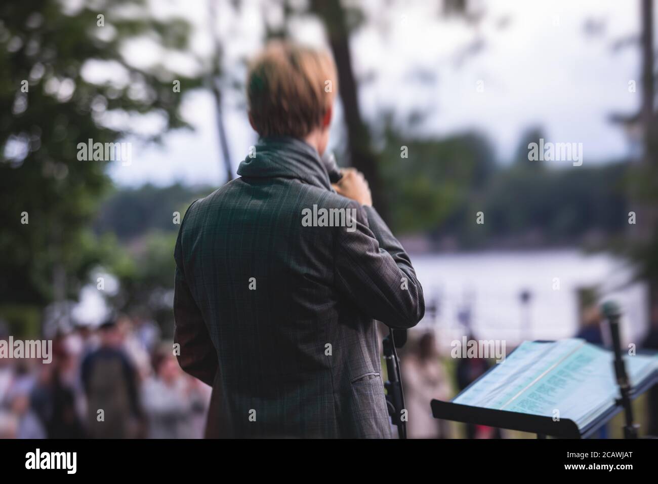 View of jazz vocalist singer with microphone performing on a stage with ...