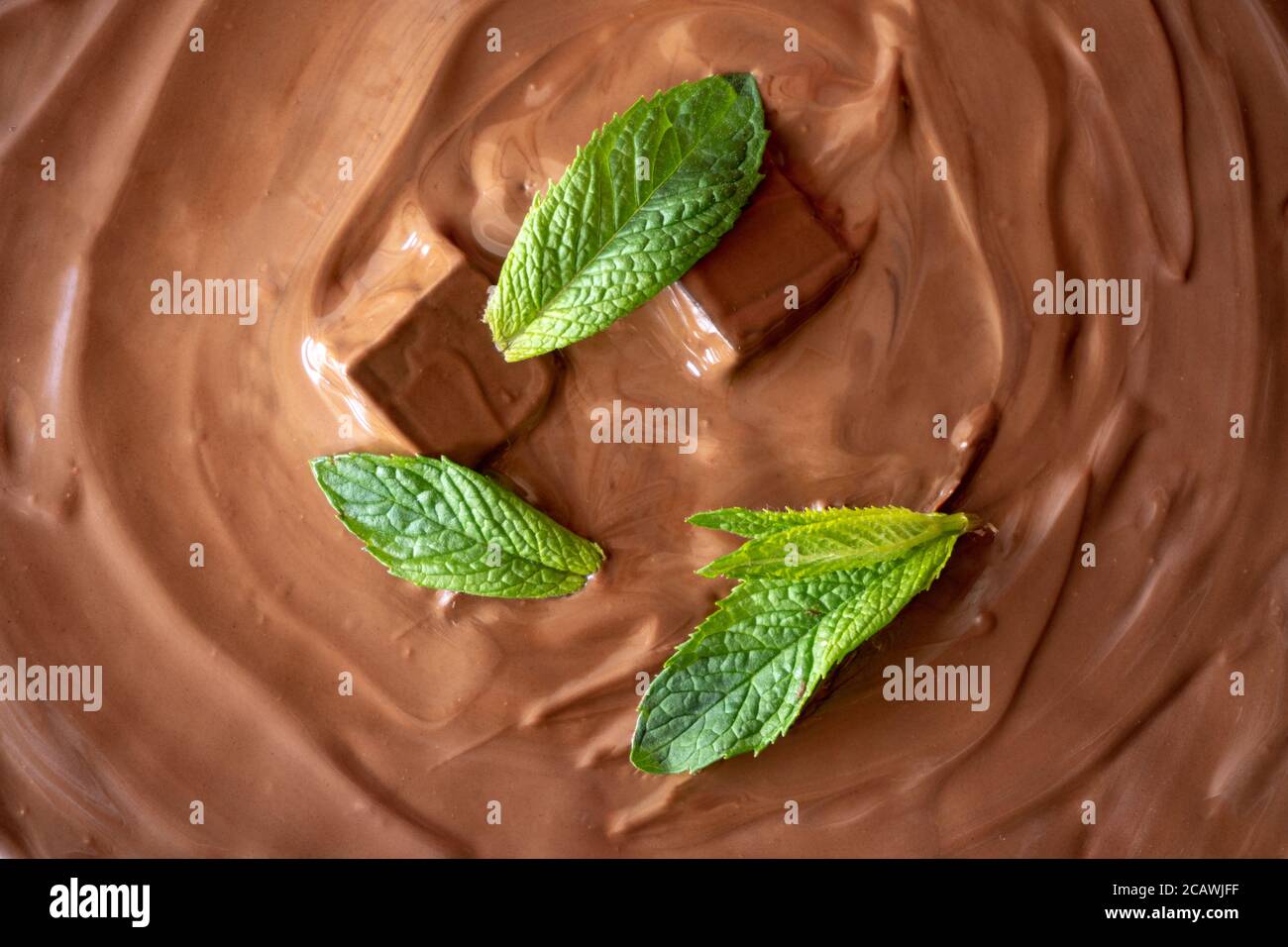 melted chocolate and mint mix background Stock Photo - Alamy