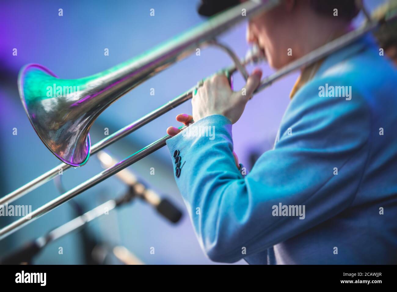 Concert view of a trombone player trombonist with musical jazz band ...