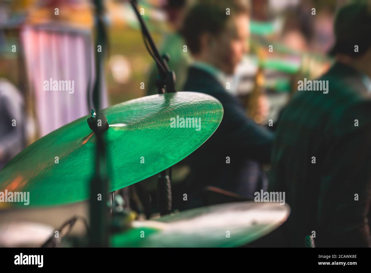 Drummer percussionist performing on a stage with drum set kit during ...