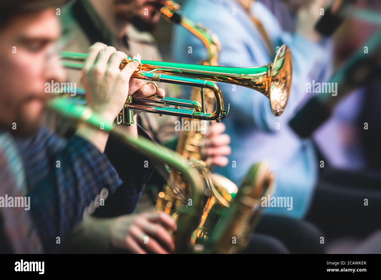 Concert view of a male trumpeter, professional trumpet player with ...