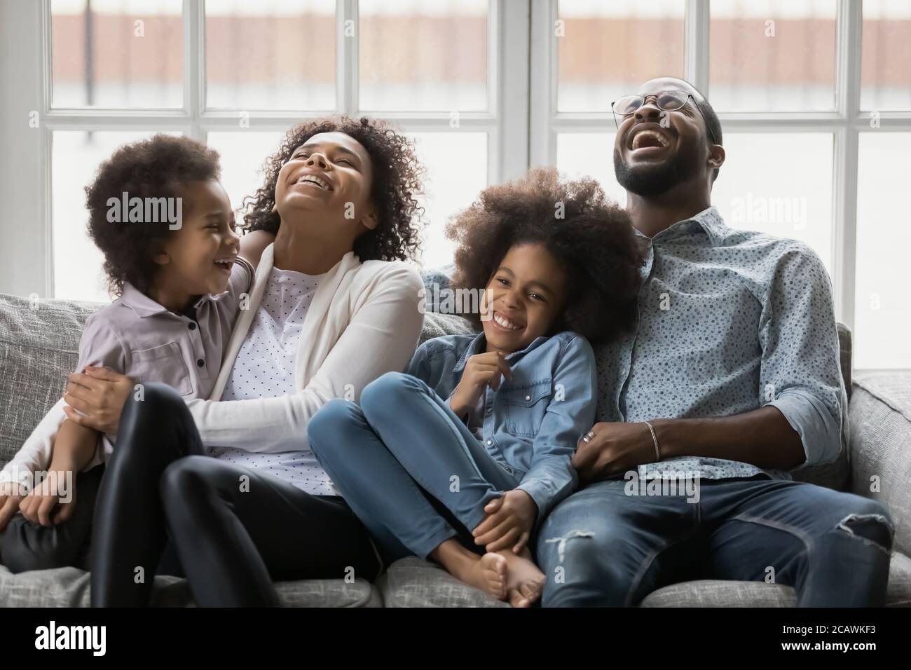 Happy biracial family with kids have fun at home Stock Photo - Alamy
