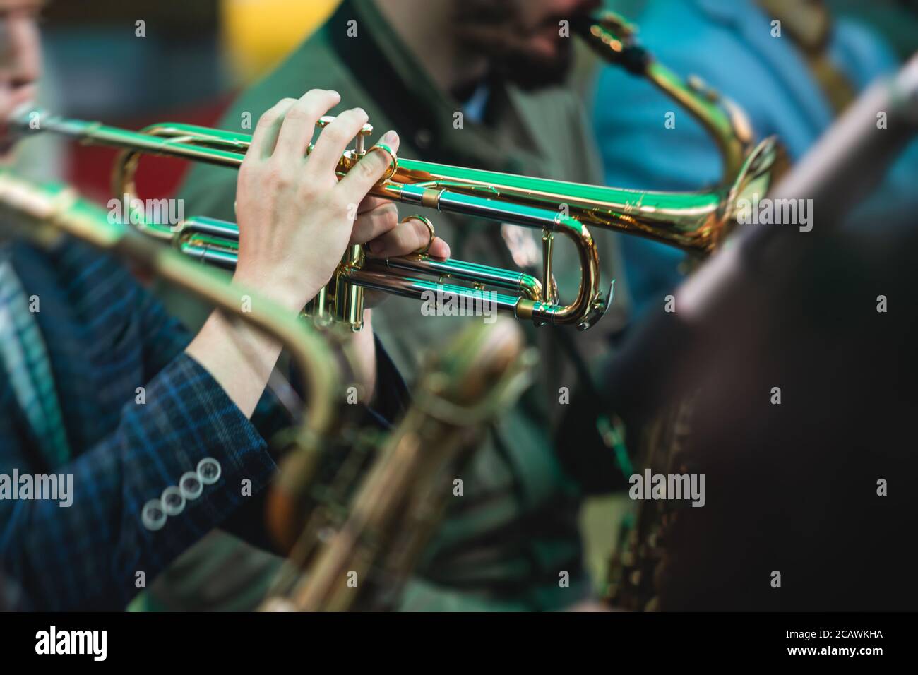 Concert view of a male trumpeter, professional trumpet player with ...
