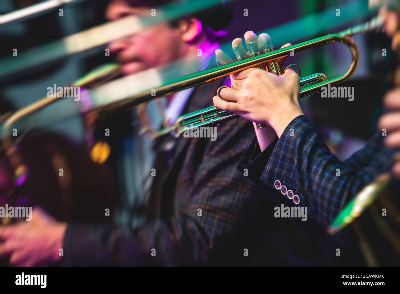 Concert view of a male trumpeter, professional trumpet player with ...