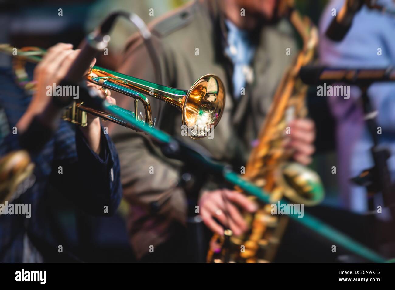 Concert view of a male trumpeter, professional trumpet player with ...