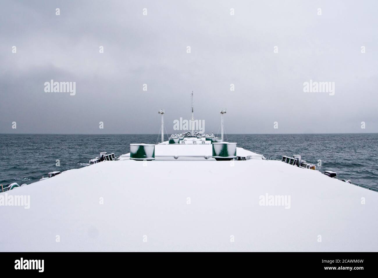 Cargo ship during winter Stock Photo - Alamy