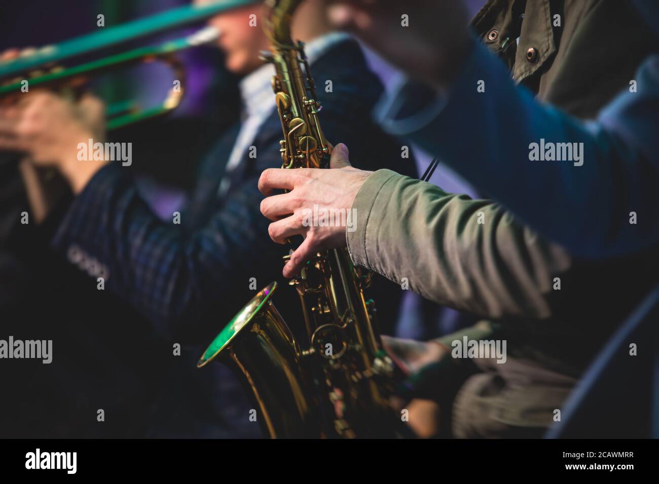 Concert view of a saxophonist, saxophone sax player with vocalist and ...