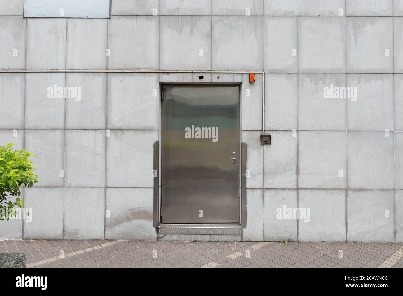 sidewalk by street wall & door Stock Photo - Alamy
