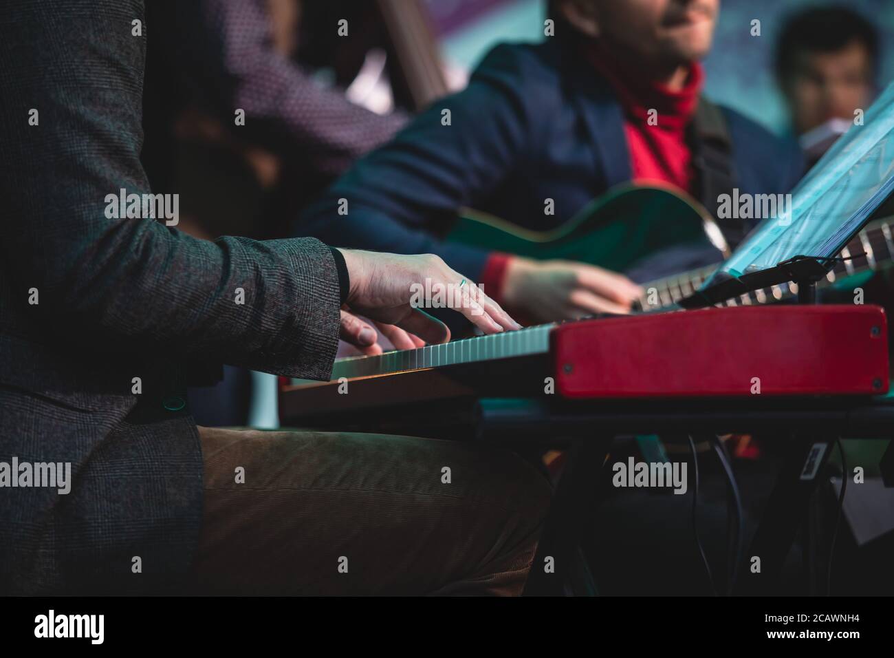 Concert view of a musical keyboard piano player during musical jazz ...