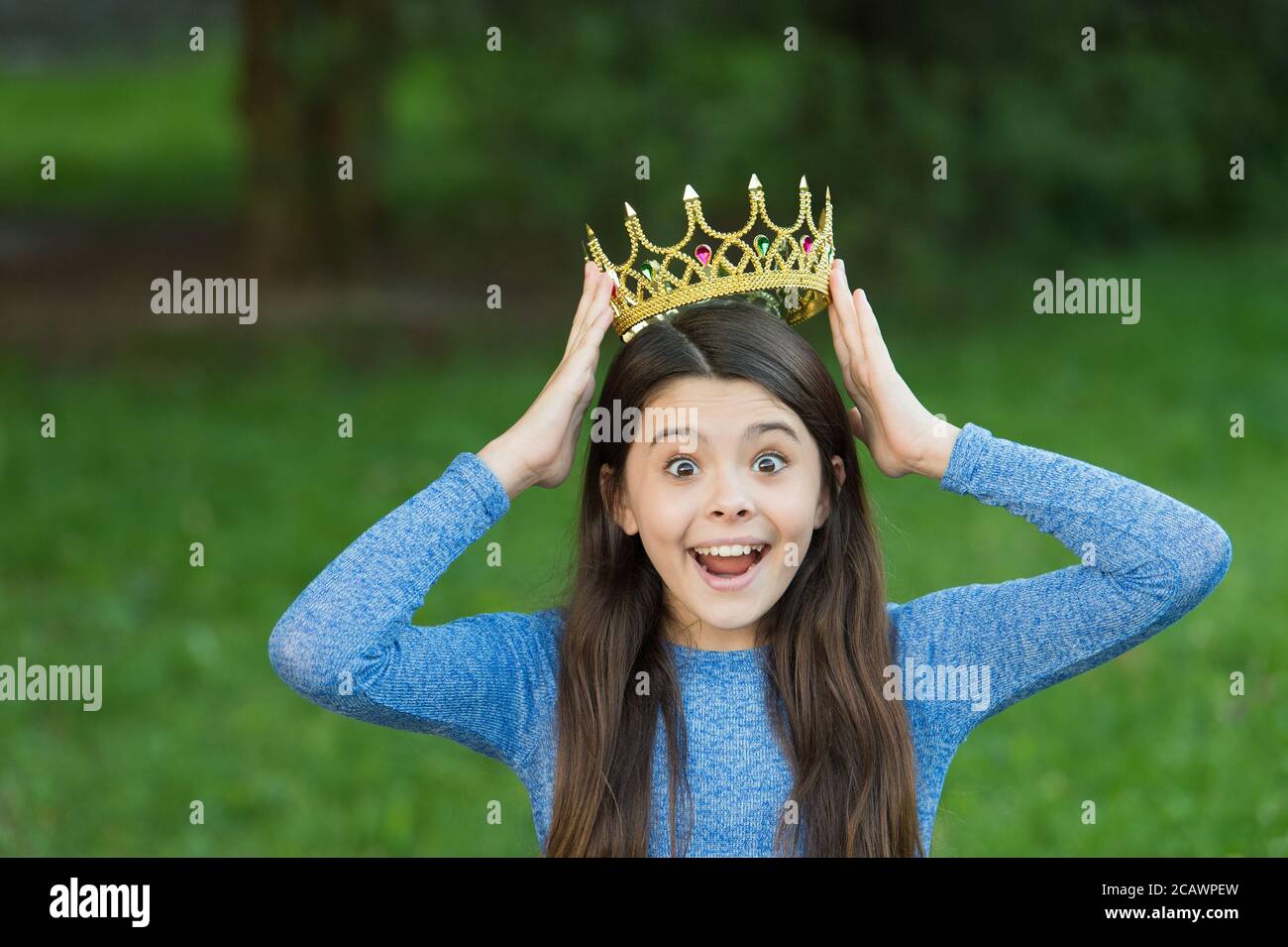 Cute girl golden crown outdoors green nature background, such an honor ...