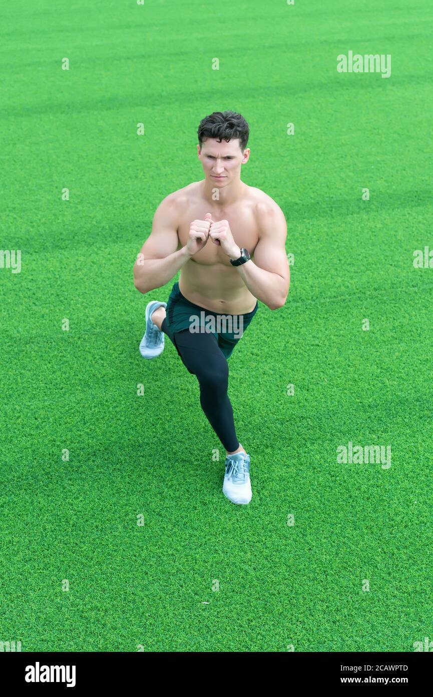 fitness man working out outdoor. man training body. man with muscular ...