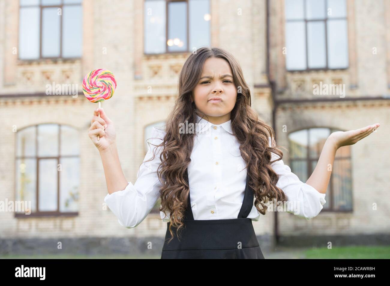 School nutrition. Sugar diet. Sweet joy. Happy kid with sweet candy ...