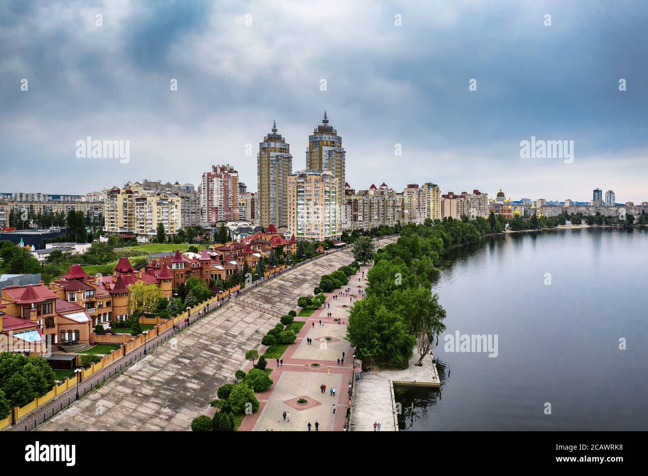 Aerial view on river Dnepr with cloudy sky and house district in green ...