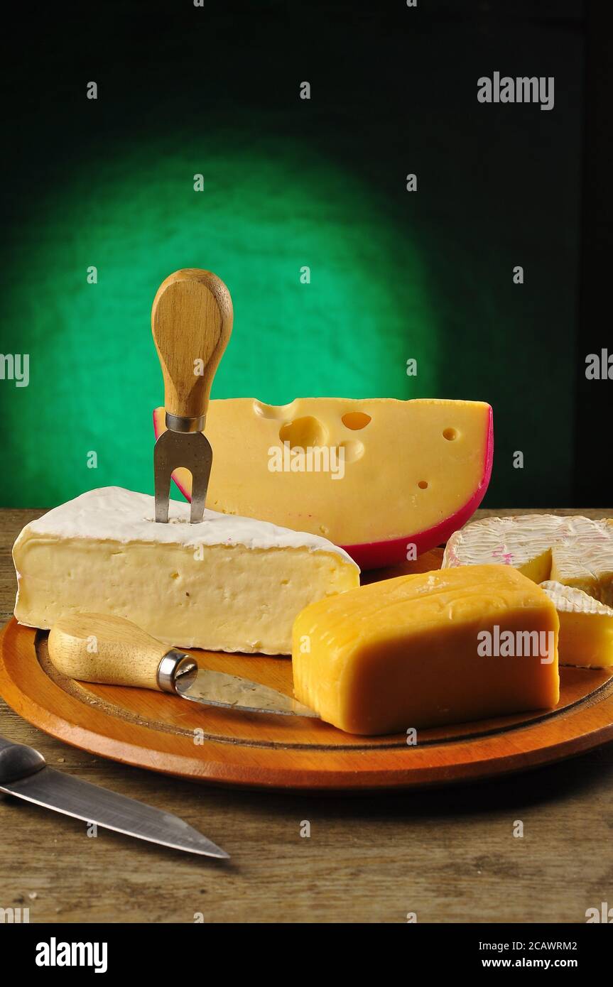 Table of mixed cheese on a studio shot Stock Photo - Alamy