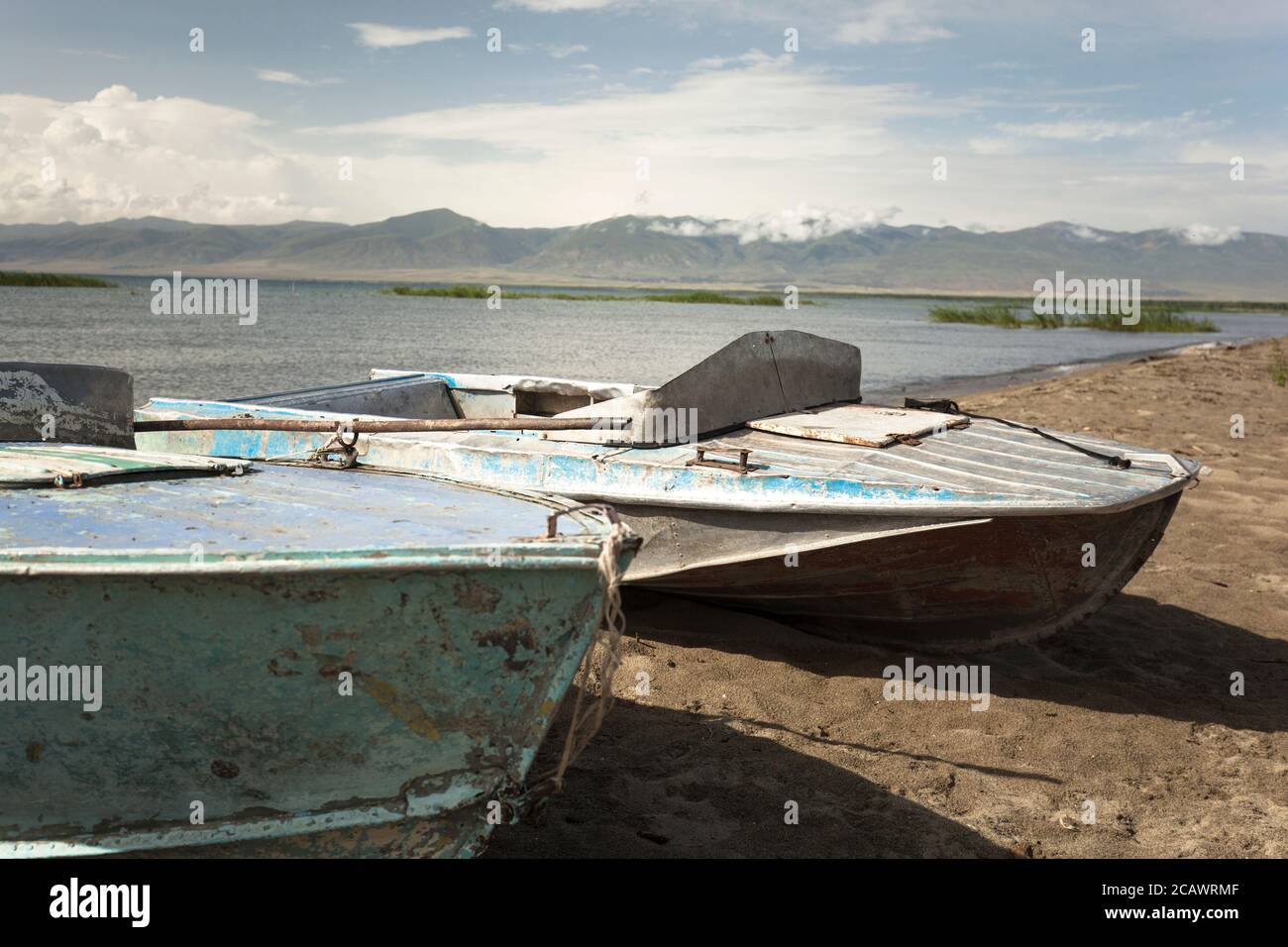 Fishing boats on a coast of Lake Sevan, Armenia Stock Photo - Alamy