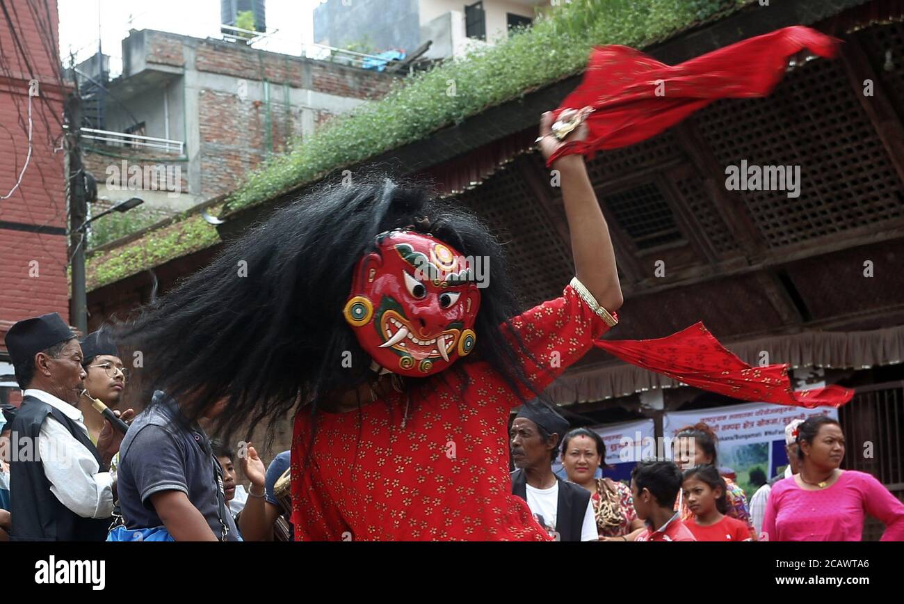 Lalitpur, Nepal. 9th Aug, 2020. A masked dancer, populary known as ...