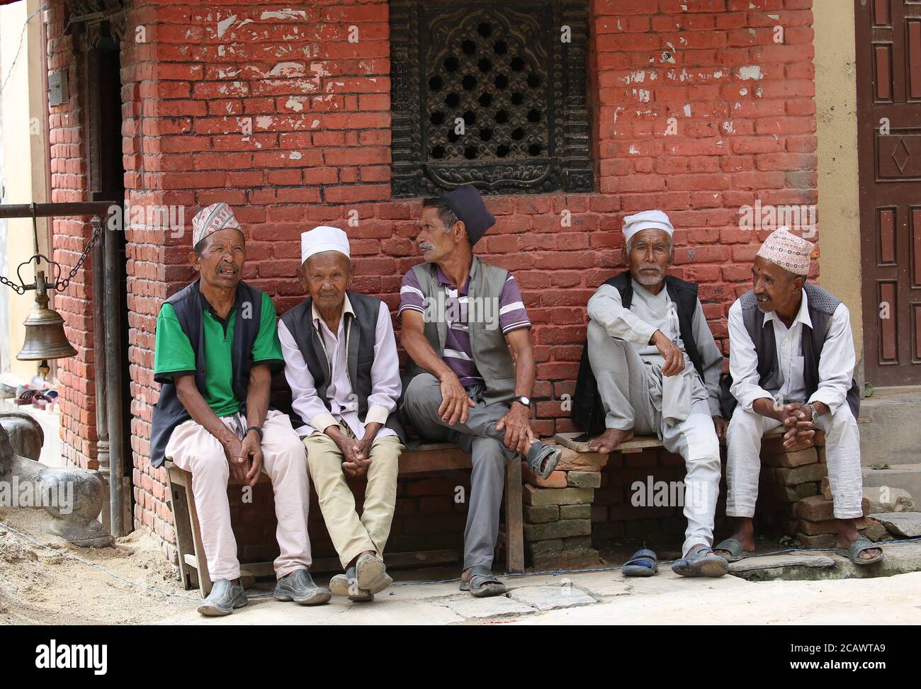 Lalitpur, Nepal. 9th Aug, 2020. Elderly persons of Newar community chat ...
