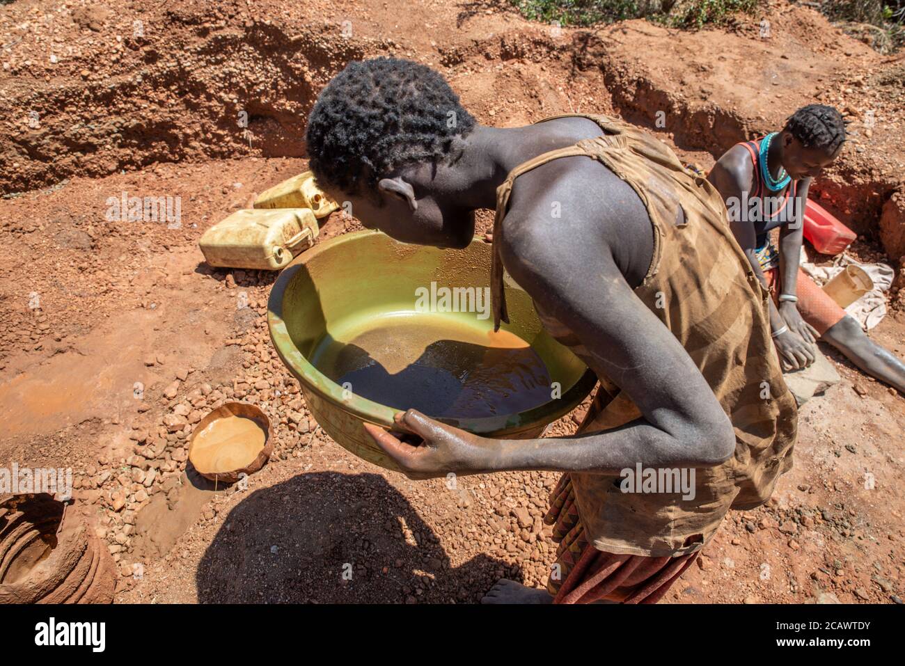 Looking for gold specks in a family-run small scale mine, Moroto ...