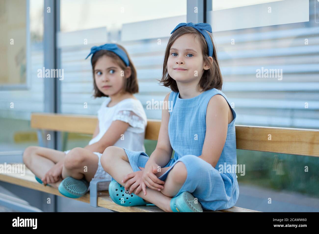 Two Girls Bus Stop High Resolution Stock Photography and Images - Alamy