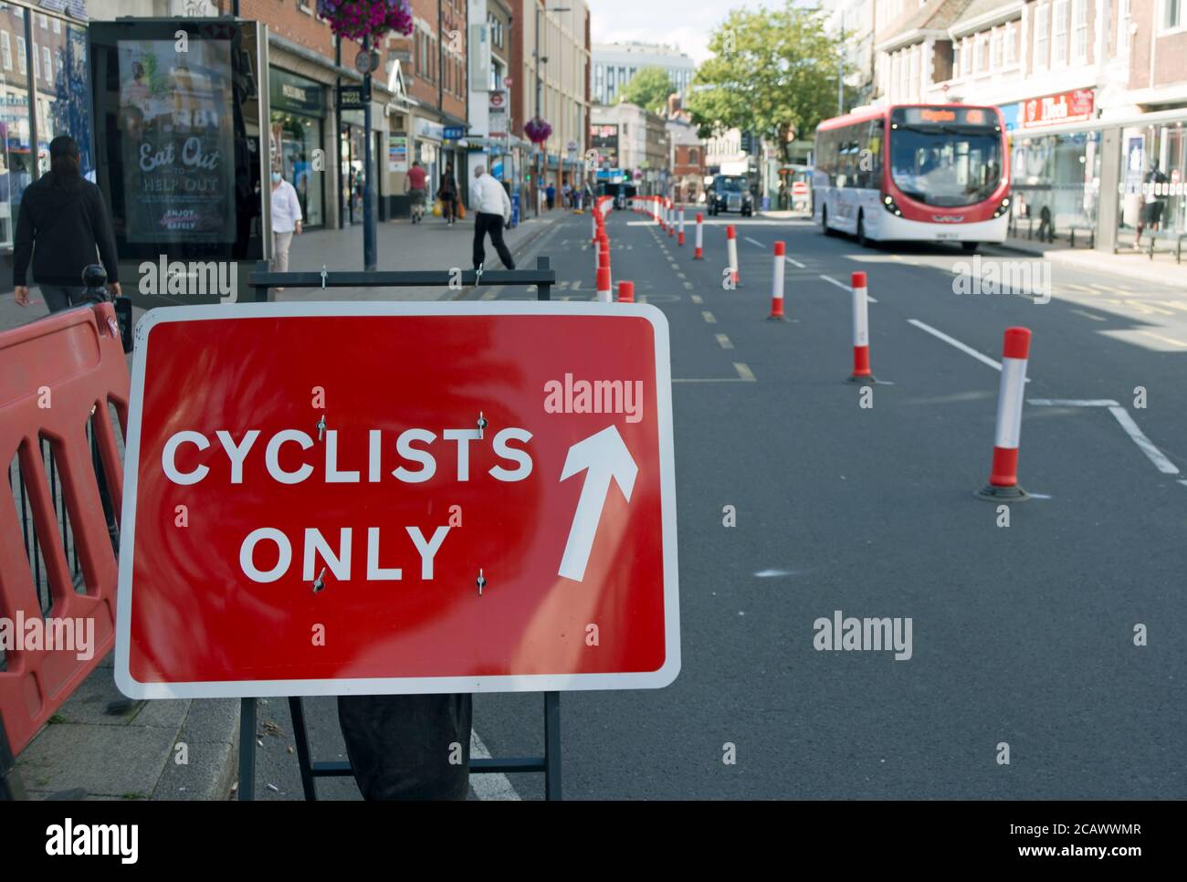temporary cycle lane marked by wands and a sign stating cyclists only ...