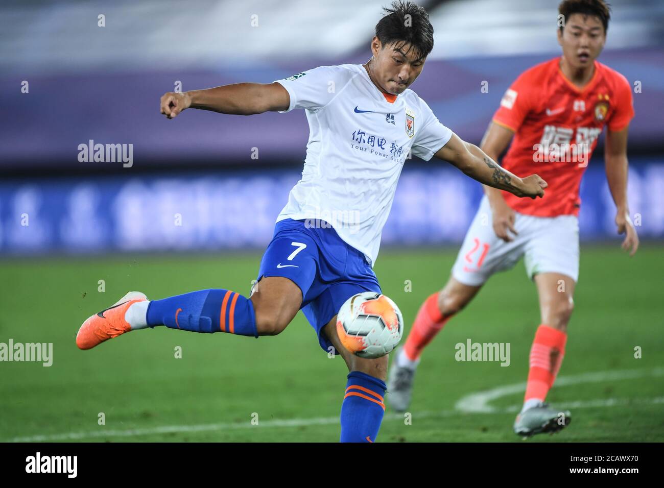 Dalian, China's Liaoning Province. 9th Aug, 2020. Guo Tianyu (L) of Shandong Luneng Taishan ...