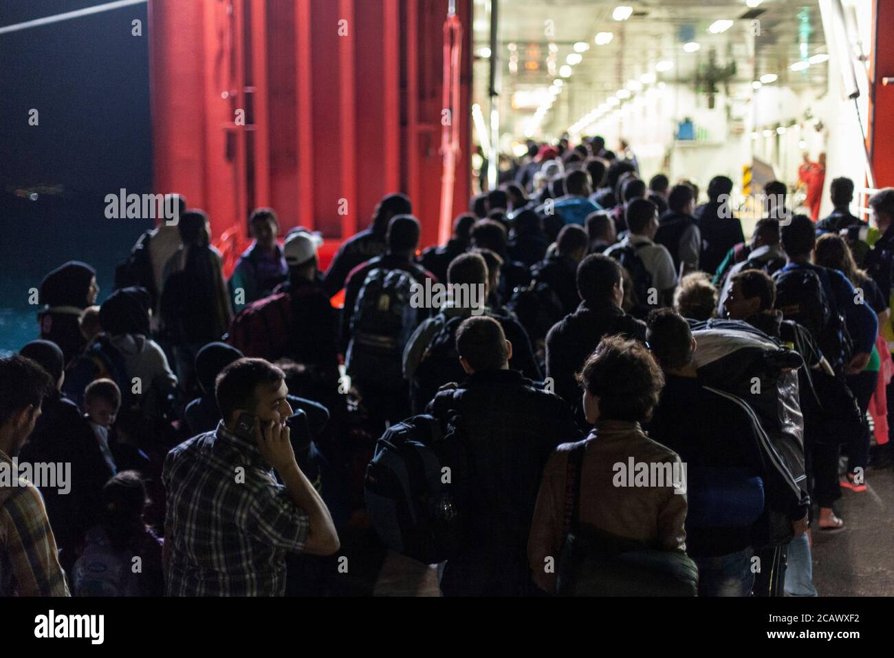 People embark ferry Stock Photo - Alamy