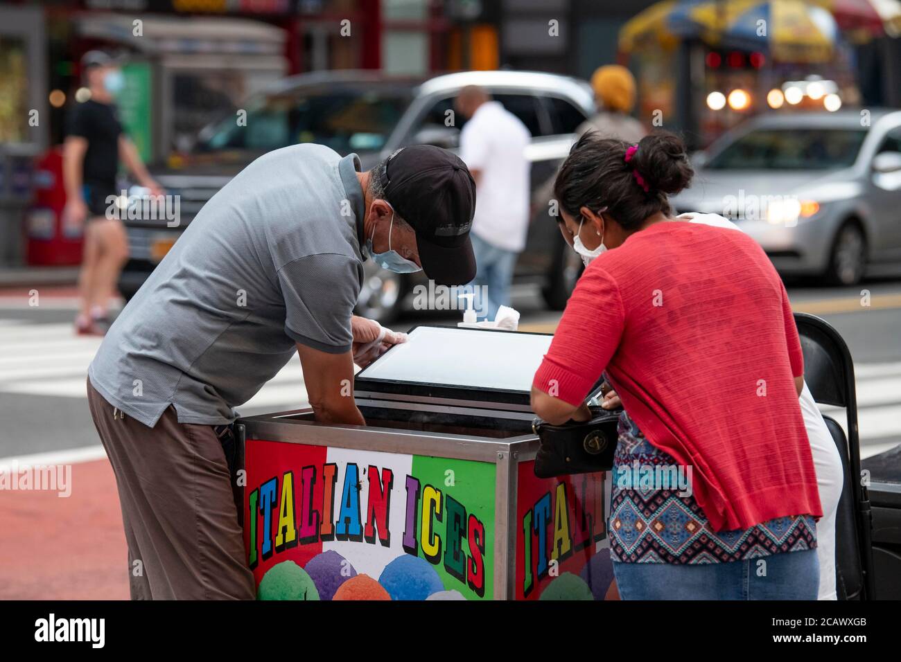 August 08, 2020: A street vendor in Times Square wearing a face mask ...
