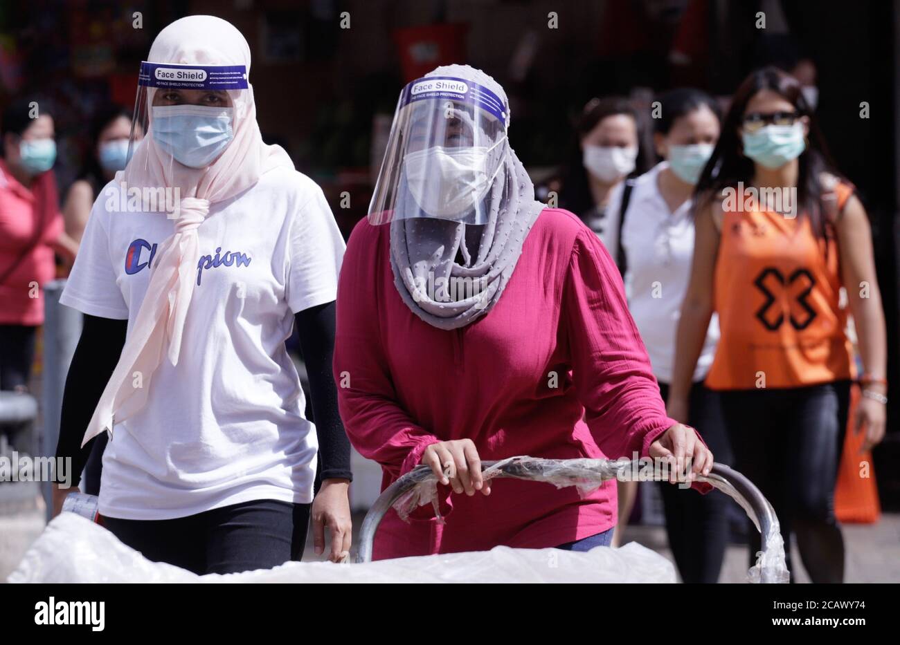 Hong Kong. 9th Aug, 2020. Indonesian domestic helpers with protective ...