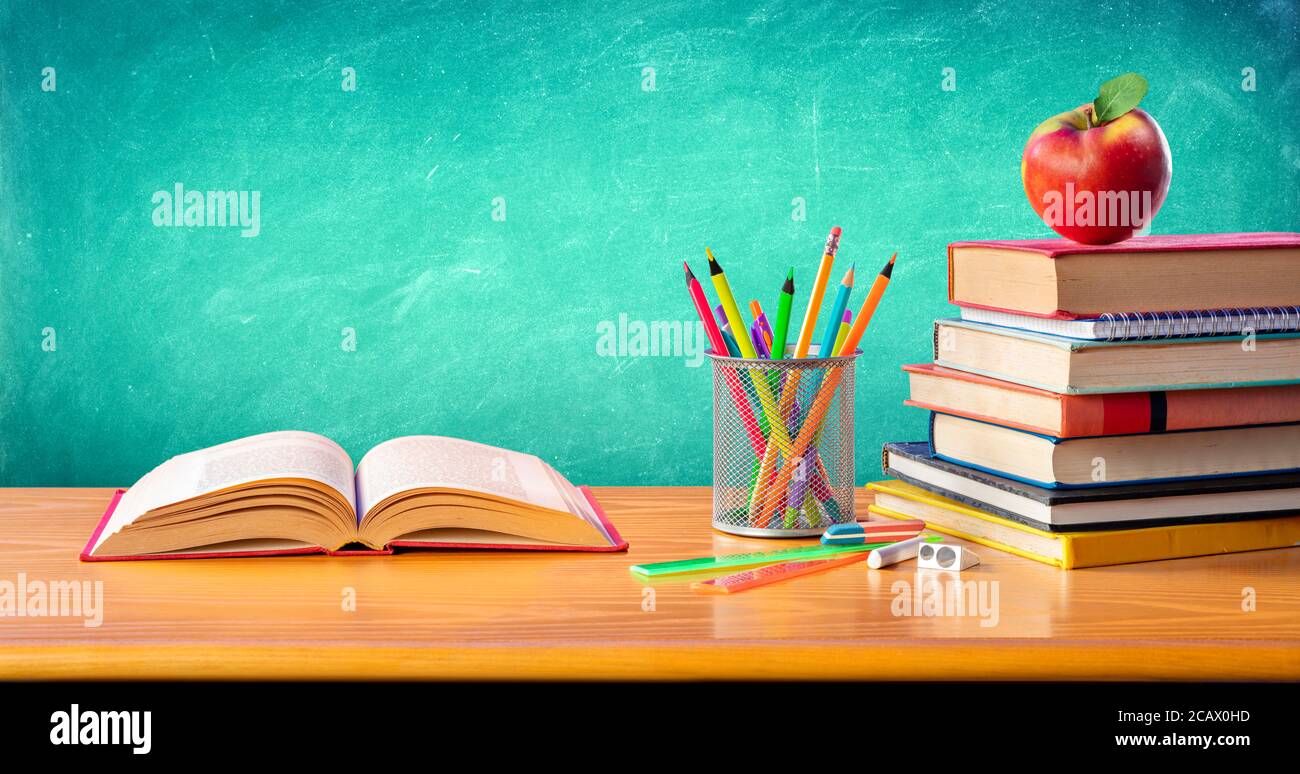 Stack Of School Books With Apple