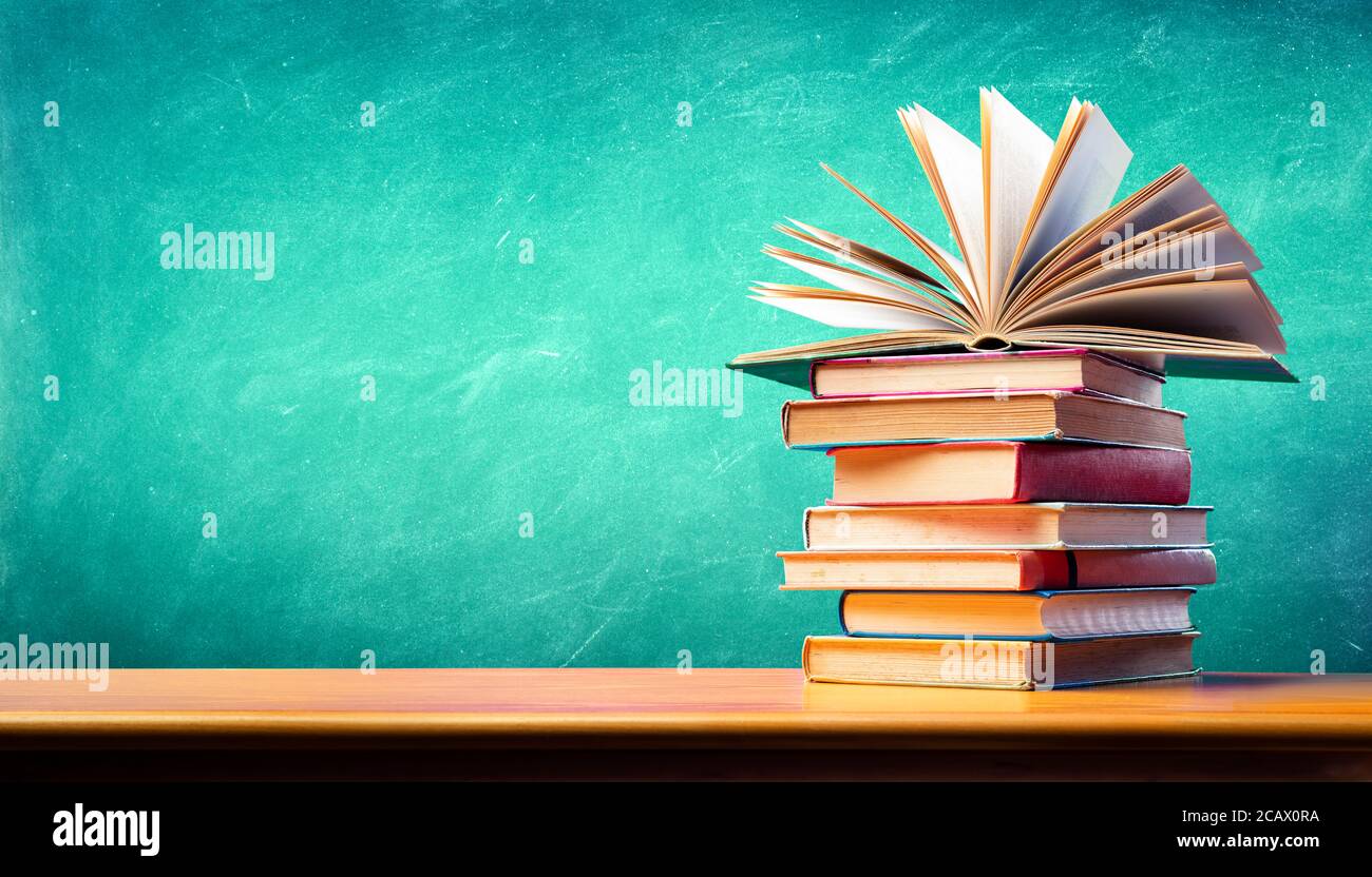 Stack Books With Green Blackboard - Back To School Stock Photo - Alamy