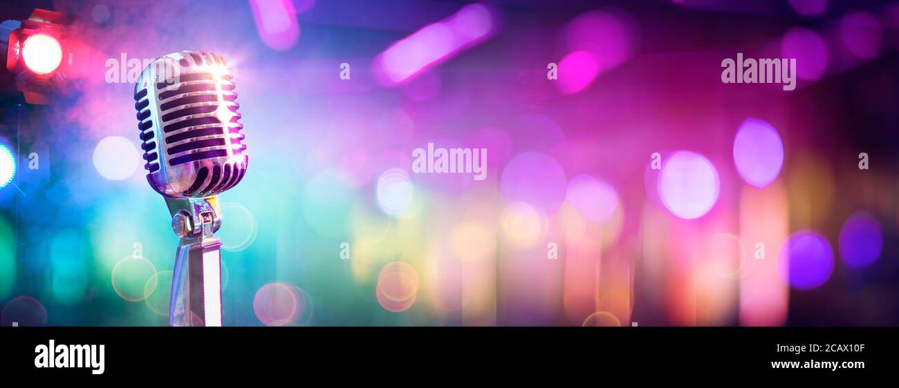 Vintage Microphone On Stage With Bokeh Light Stock Photo - Alamy