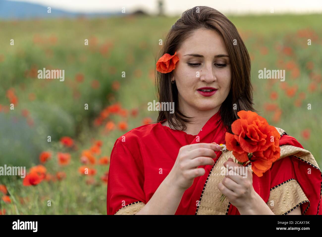Young woman dressed in a traditional Indian costume called Sari walking ...