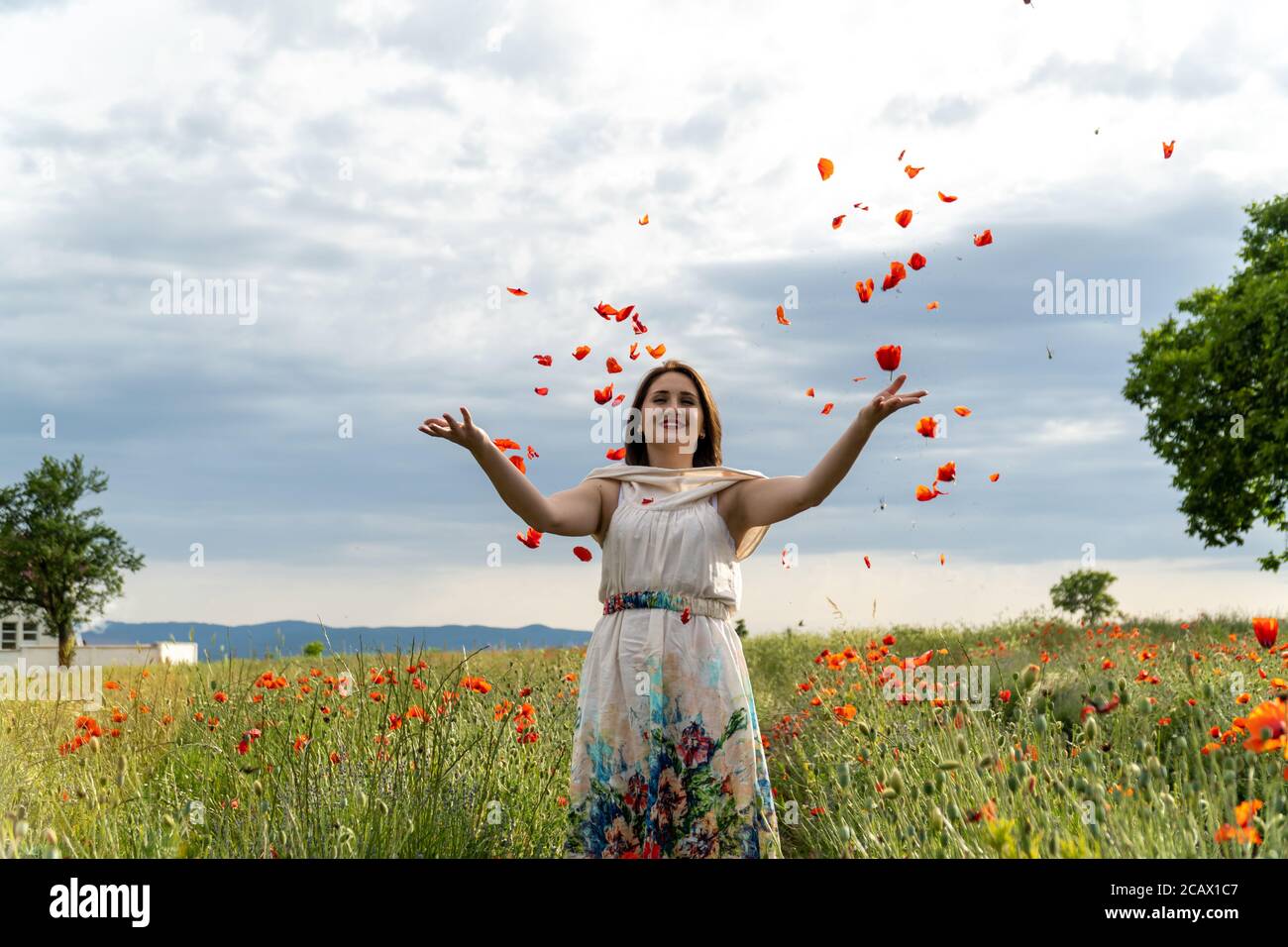 Throwing flowers in the air hi-res stock photography and images - Alamy