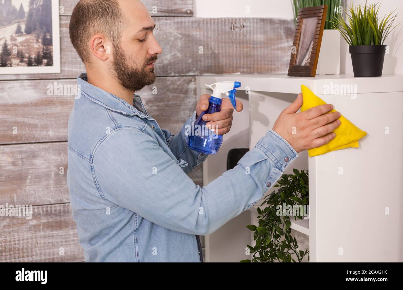 Dusting lamp table hand hi-res stock photography and images - Alamy