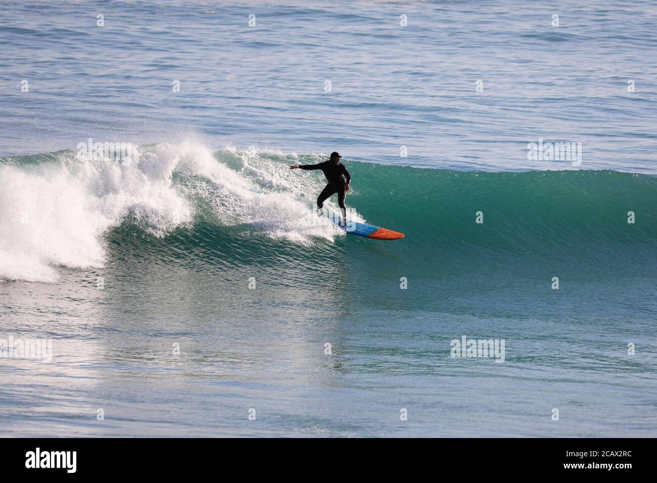 Surfer in the water at Bloubergstrand, Cape Town, South Africa Stock ...