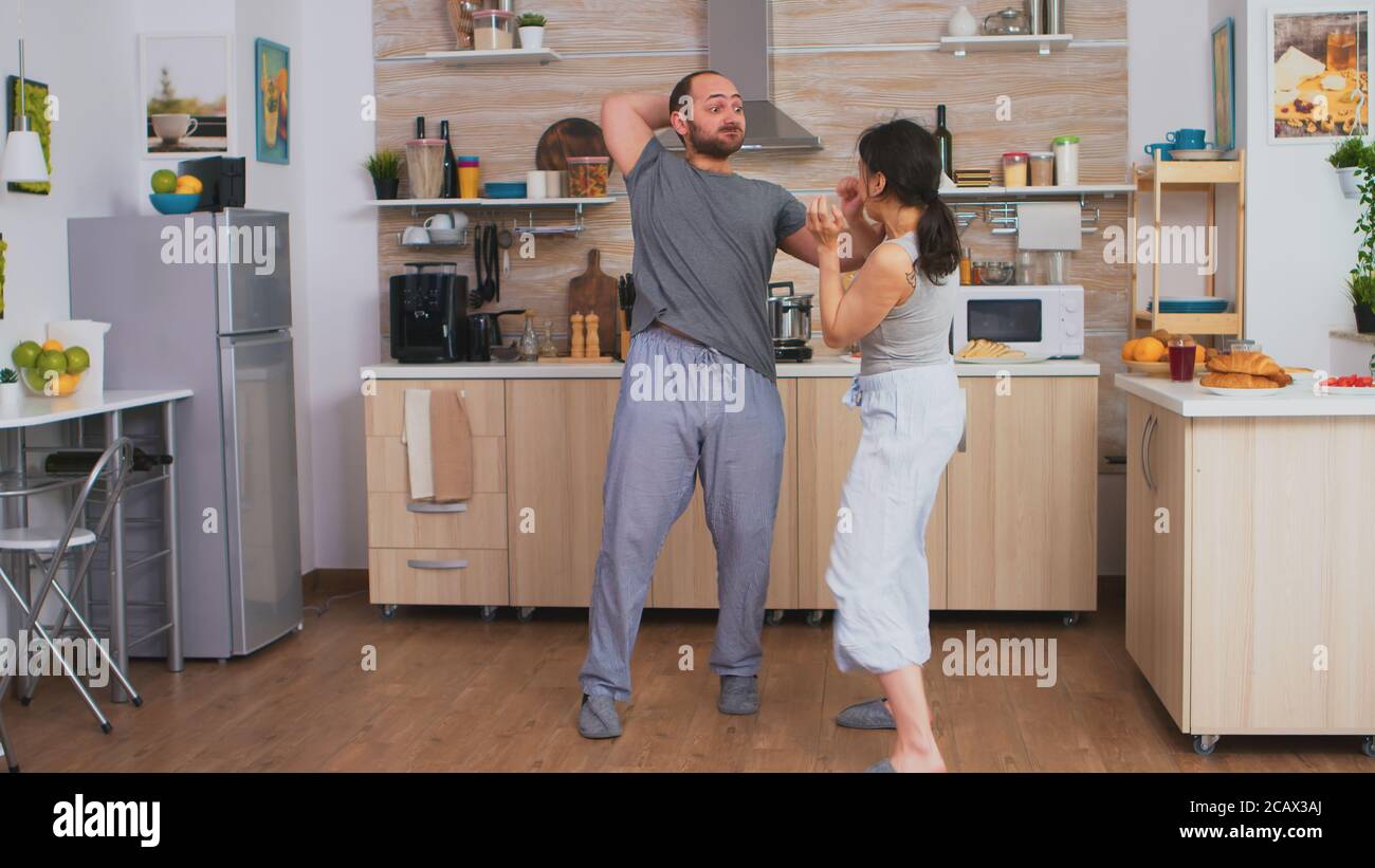 Married couple arguing at the kitchen during breakfast. Domestic ...