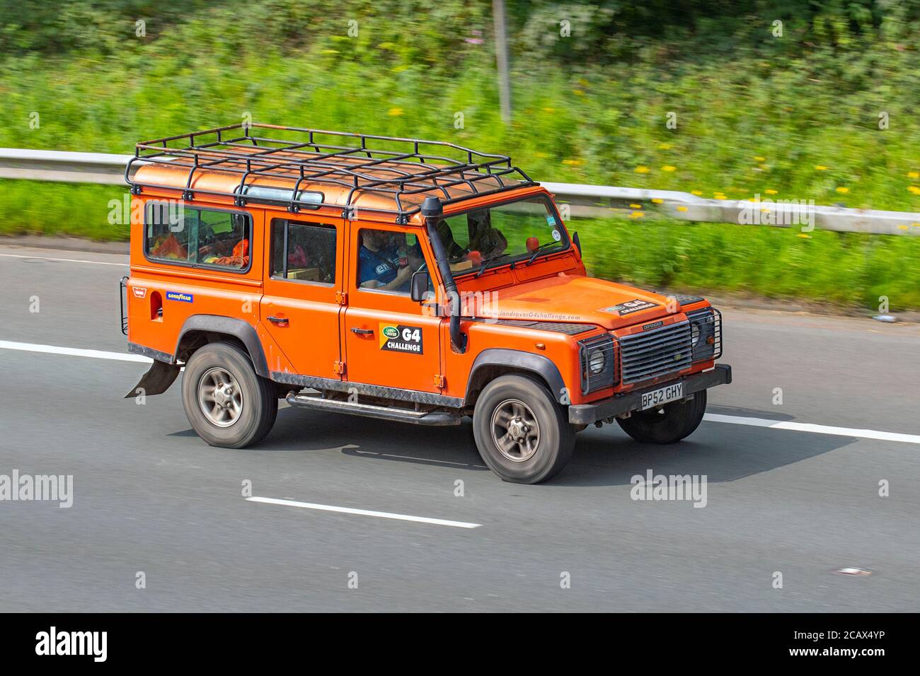 2003 Orange Land Rover Defender 110 TD5 County G4 Challenge; a global ...