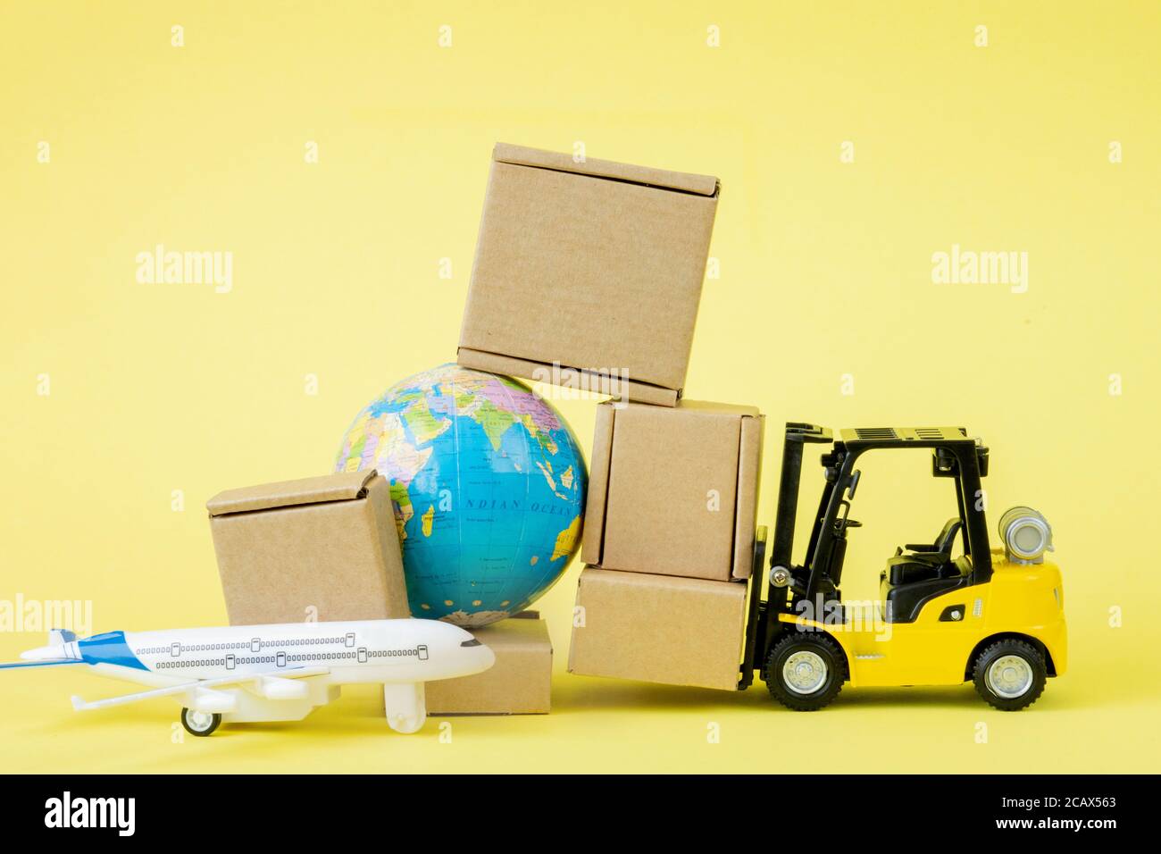 Mini forklift truck load cardboard boxes in the Airplane. Fast delivery ...
