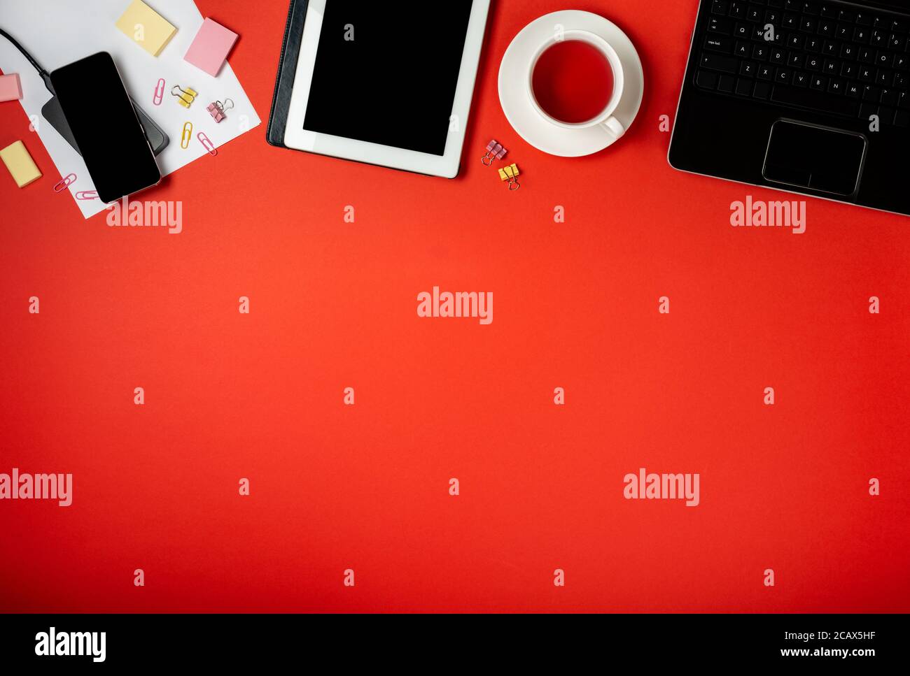 Office red workspace with office supplies and copy space Stock Photo ...