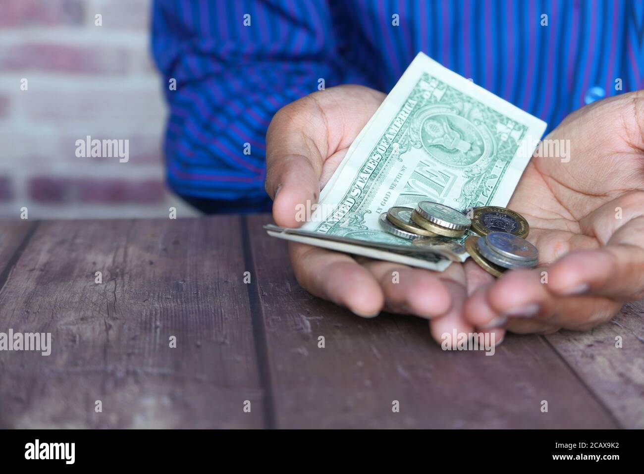 Hand dollar poverty hi-res stock photography and images - Alamy