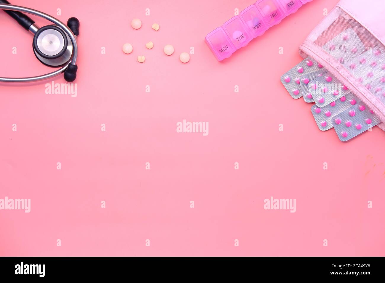 flat composition of stethoscope and pills on pink background Stock ...