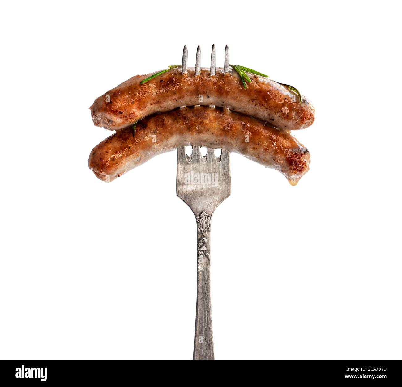 Cooked sausage chipolatas on a fork isolated on white background Stock ...