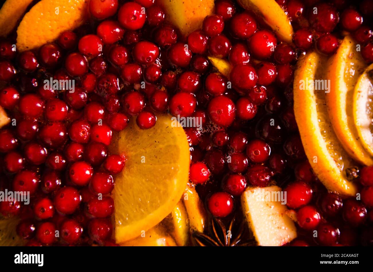 metal pot on the stove. Oranges and cranberries in mulled wine Stock ...