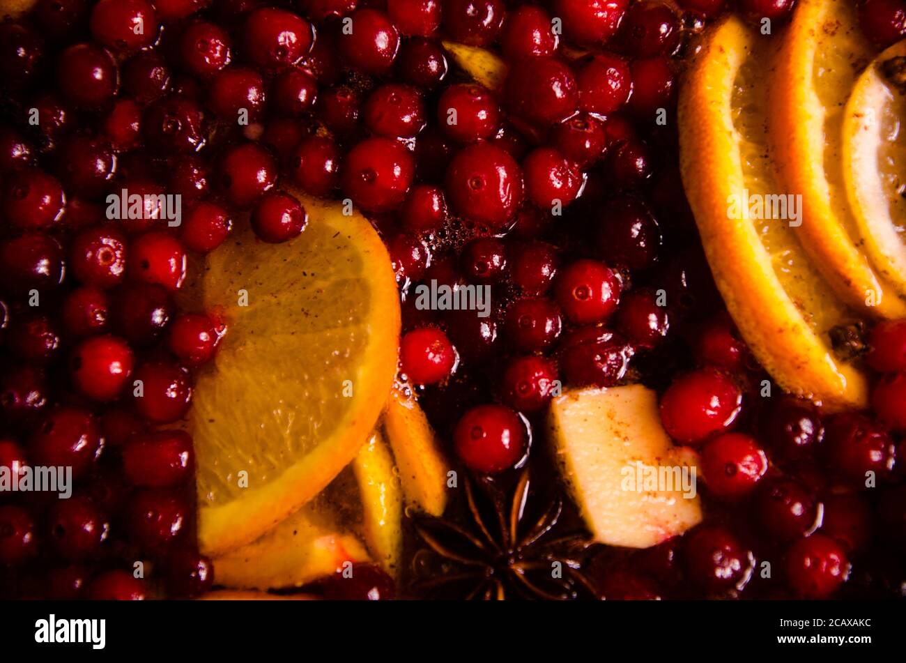 metal pot on the stove. Oranges and cranberries in mulled wine Stock ...