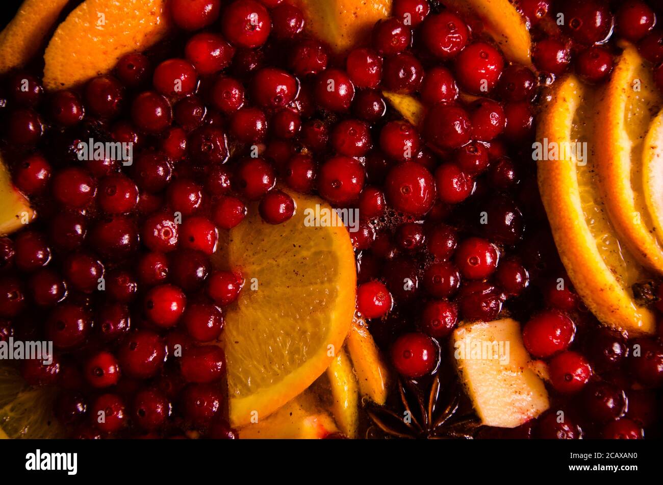 metal pot on the stove. Oranges and cranberries in mulled wine Stock ...